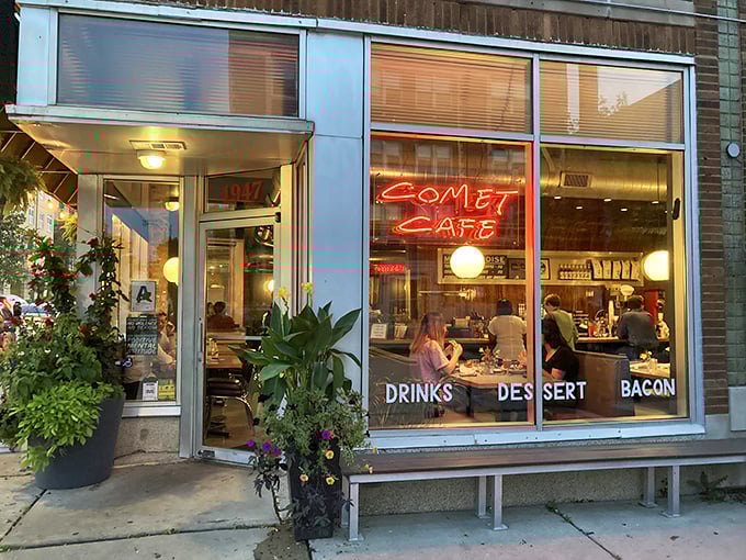 Neon dreams and comfort food schemes! Comet Cafe's storefront beckons like a retro-chic lighthouse, promising a galaxy of flavors within its cozy confines.
