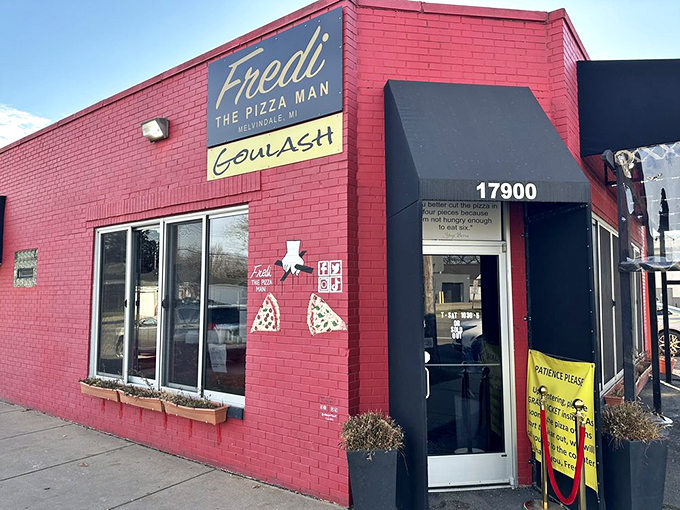 A beacon of pizza perfection! Fredi The PizzaMan's vibrant red exterior is like a siren call to hungry souls, promising New York-style slices in the heart of Michigan.