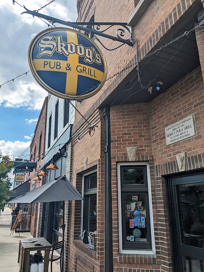 Welcome to flavor town! Skoog's Pub & Grill's inviting exterior promises a feast for the senses, with its charming brick facade and Swedish-inspired sign beckoning hungry travelers.