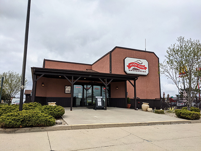 Welcome to barbecue paradise! Hickory River Smokehouse's unassuming exterior hides a world of smoky delights within. It's like finding a treasure chest disguised as a garden shed.