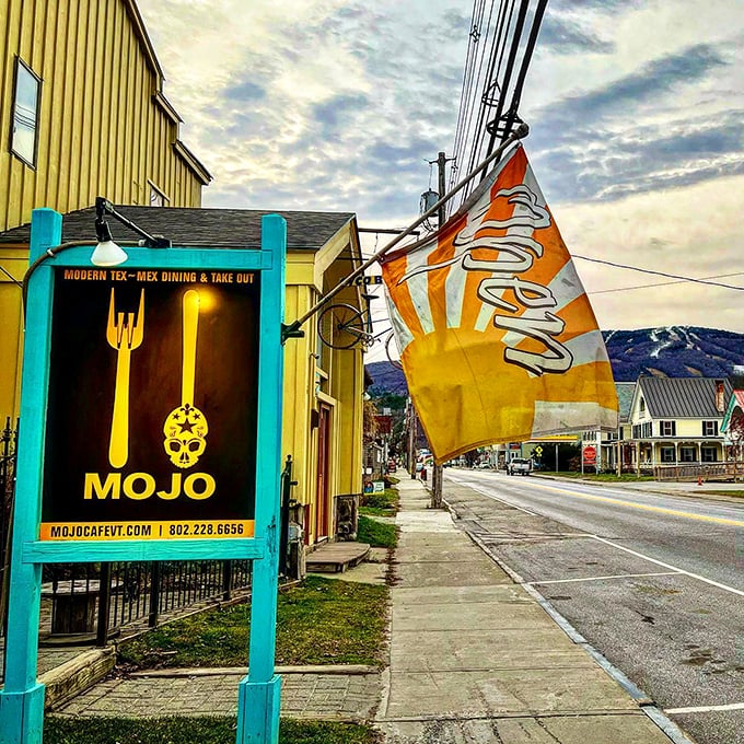 Mojo Cafe: Where Vermont's chill vibe meets Mexico's sizzle. This sunny facade is like a portal to flavor town, complete with twinkling lights and funky decor.