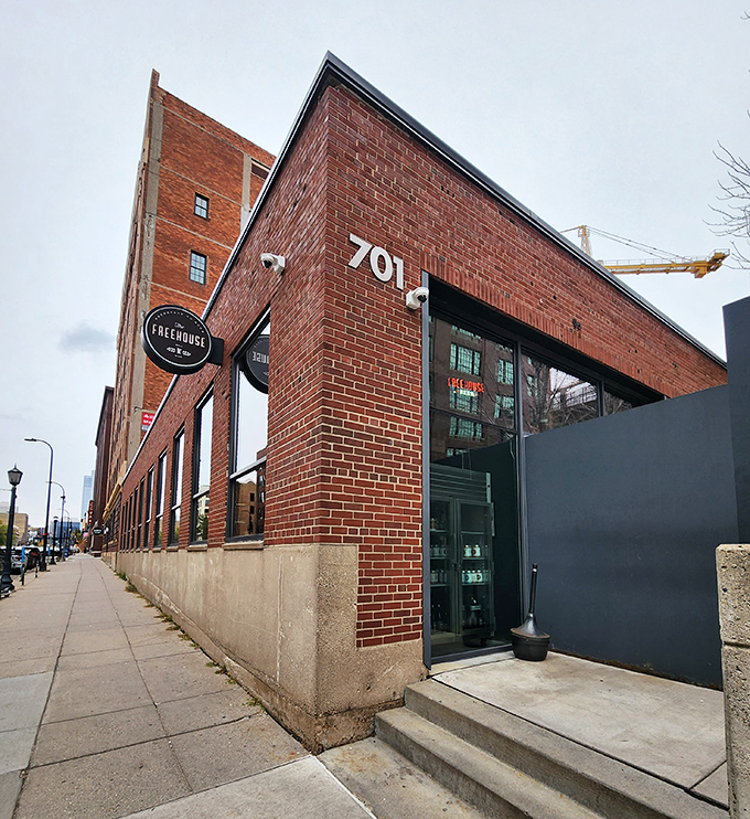 Welcome to The Freehouse, where industrial chic meets comfort food paradise. This brick facade isn't just a pretty face—it's the gateway to beer-lover's bliss.