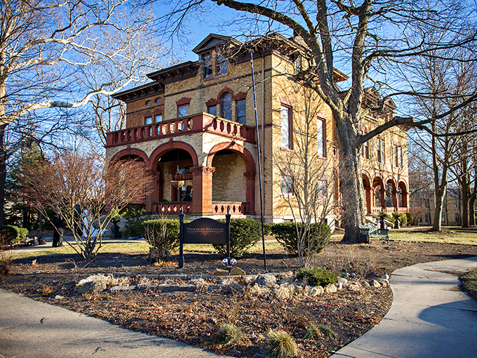 A grand entrance fit for a Victorian novel! This yellow brick beauty stands tall, inviting you to step back in time and indulge in some 19th-century glamour.