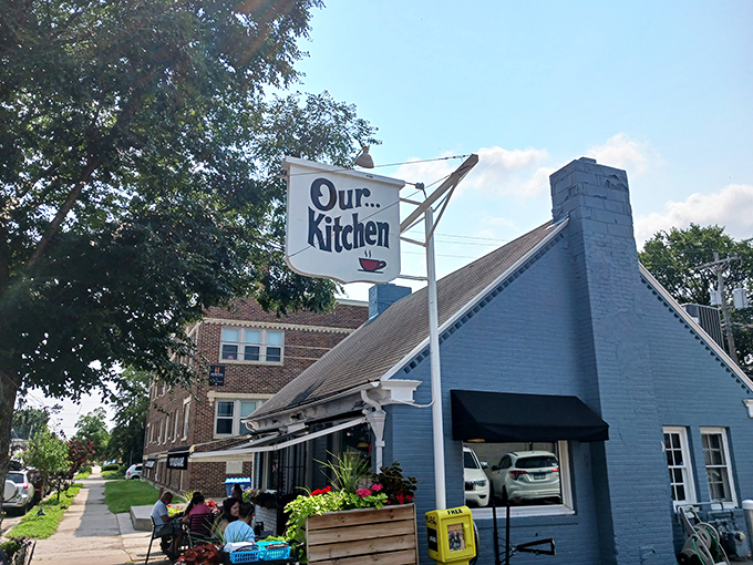 A blue beacon of breakfast bliss! Our Kitchen's charming exterior promises pancake paradise within its cozy confines.
