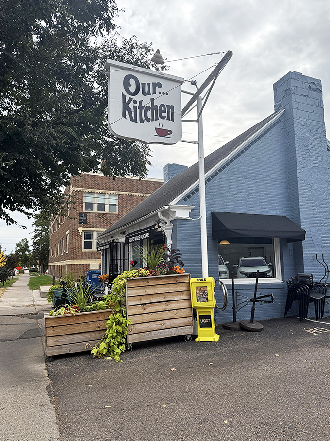 A blue beacon of breakfast bliss! Our Kitchen's charming exterior promises pancake paradise within its cozy confines.