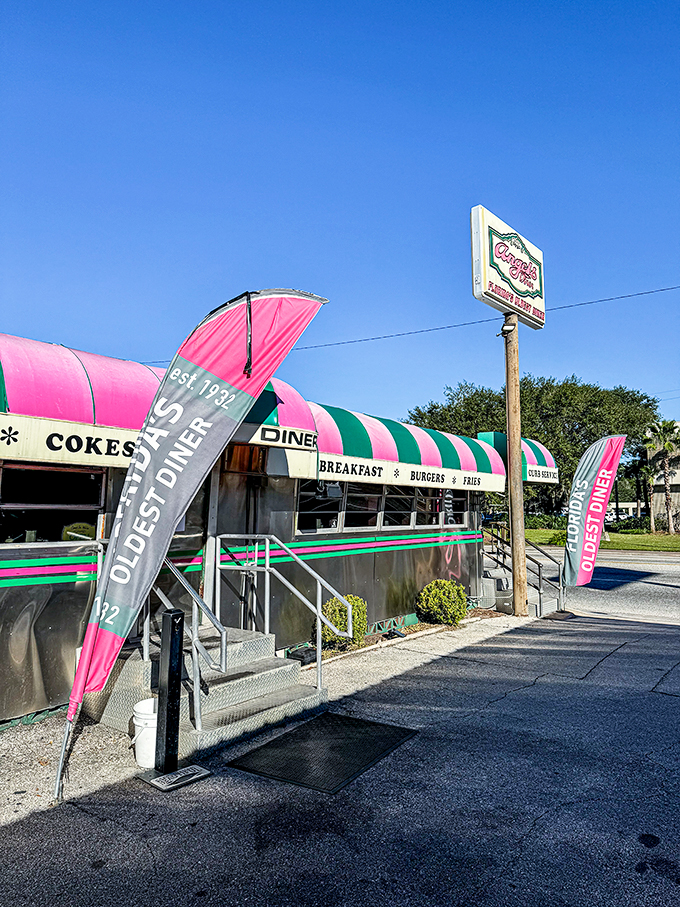 Step back in time! Angel's Dining Car, Florida's oldest continuously operating diner, serves up nostalgia with a side of neon-pink feather flags.