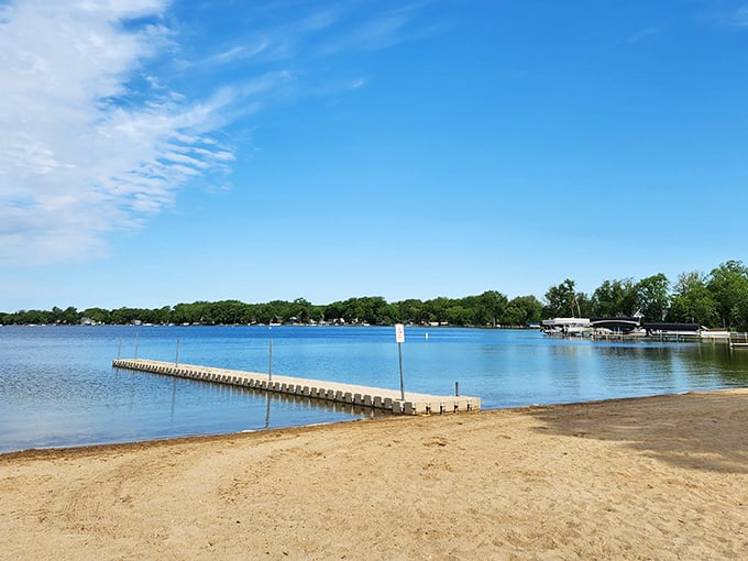 "Ahoy there, paradise seekers! This wooden walkway isn't just a pier &ndash; it's your personal red carpet to lakeside bliss. Dive in, the water's fine!"