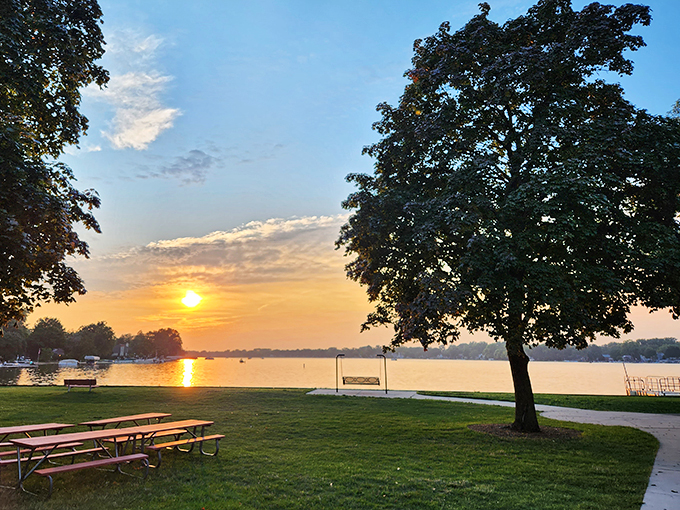 Sunset serenity: Nature's own light show paints the sky, turning Crystal Lake into a mirror of golden hues. Who needs Netflix when you've got this?