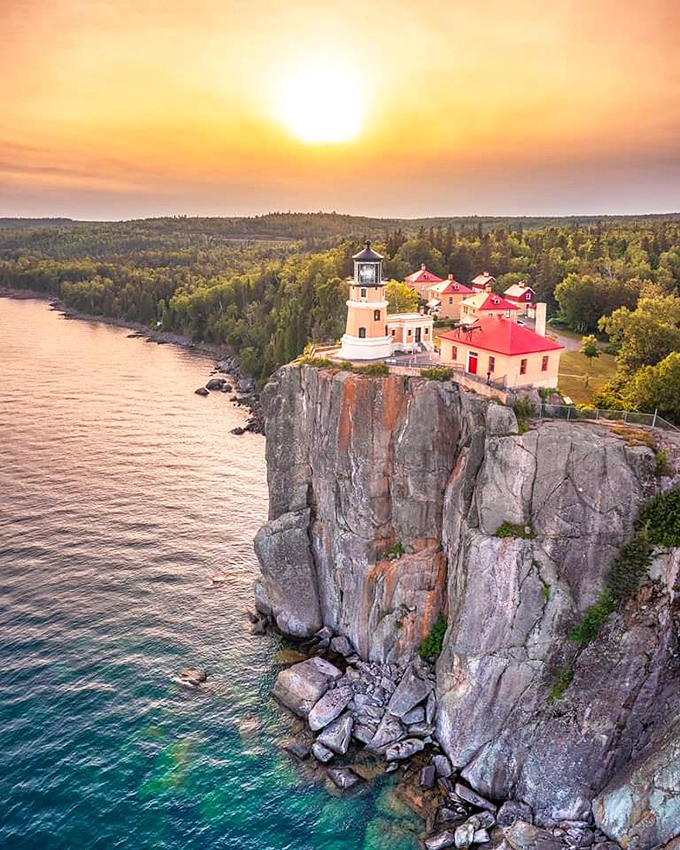 Sunset spectacle! Split Rock Lighthouse stands sentinel on its rocky perch, like a storybook castle guarding the shores of an enchanted lake.