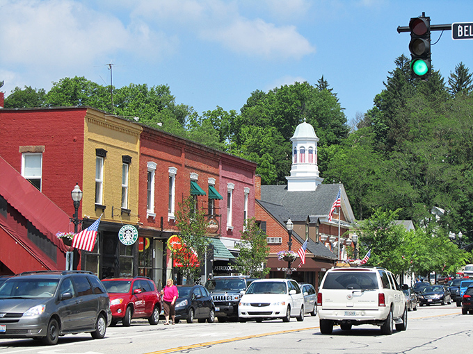 Main Street magic: Where Norman Rockwell meets Mayberry, with a dash of modern charm. American flags flutter proudly as shoppers stroll past quaint storefronts, creating a scene straight out of a nostalgic daydream.