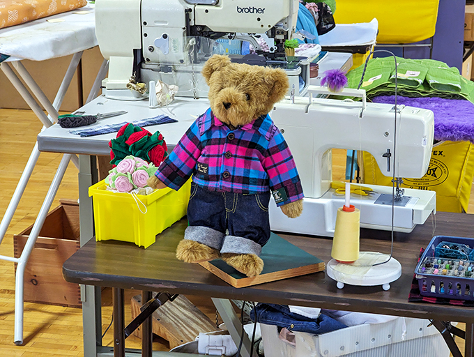 Dressed for success in plaid and denim, this dapper bear is ready for a day of Vermont adventures or a cozy night by the fire.