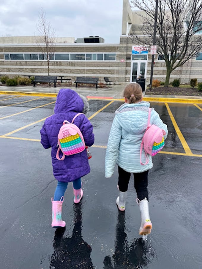 Rain or shine, the fun doesn't stop! These kiddos are proof that a little drizzle can't dampen the Pelican Harbor spirit.