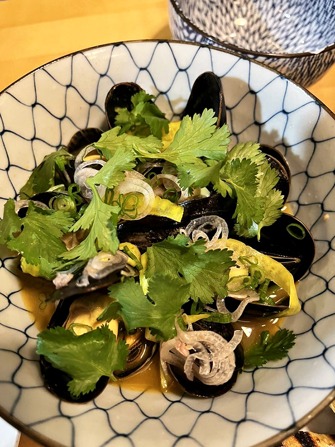 These mussels aren't just flexing &ndash; they're showing off! A bowl of briny bliss that'll have you humming "Under the Sea" between bites.
