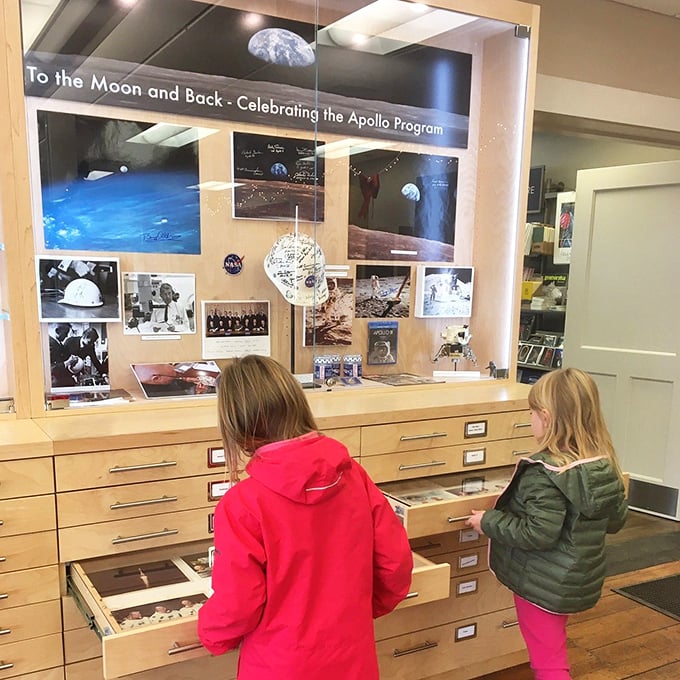 Hands-on history in the making! These young explorers are getting a taste of lunar adventure, no space suit required.