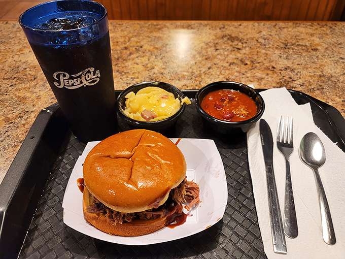 This brisket sandwich isn't just a meal, it's an experience. Each bite is a journey through layers of smoky, savory bliss. Napkins are not optional!