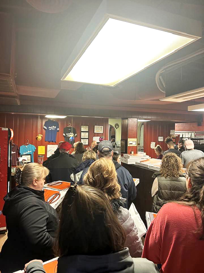 Pizza rush hour! These hungry patrons know the secret to happiness is just a slice away.