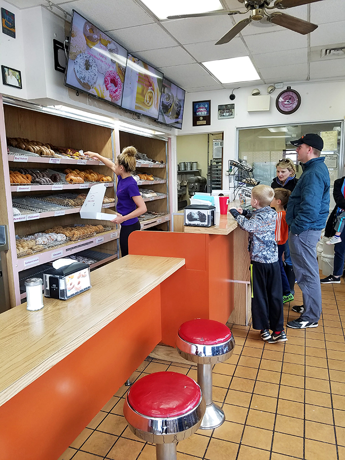 Donut devotees unite! These lucky customers are experiencing what can only be described as a religious experience in fried dough form.
