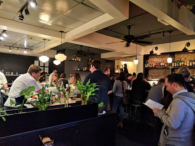 Happy diners, can't you see? Misery loves company, but company loves Misery even more! The buzz of satisfaction is practically audible.