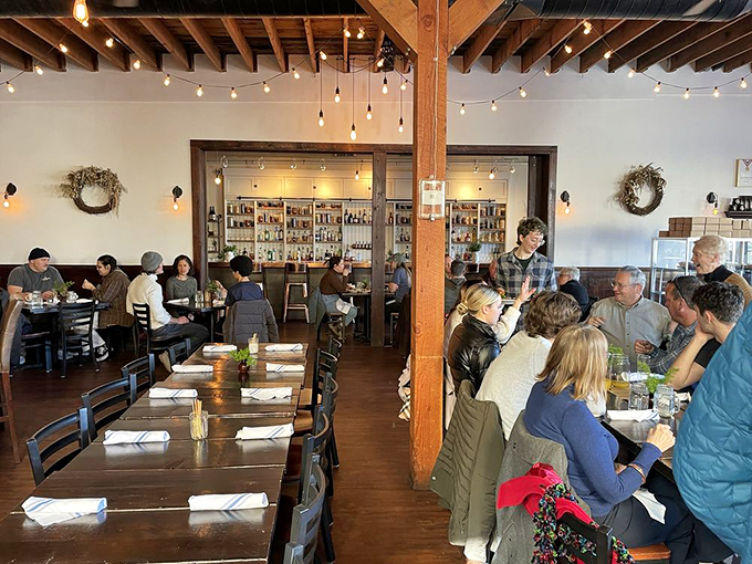 A bustling dining room that's part social club, part flavor factory. Here, strangers become friends over shared plates and knowing nods of culinary approval.