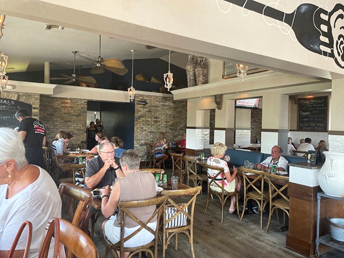 A snapshot of happiness: diners enjoying la dolce vita. It's like a scene from "The Godfather," minus the family drama and plus extra cheese.