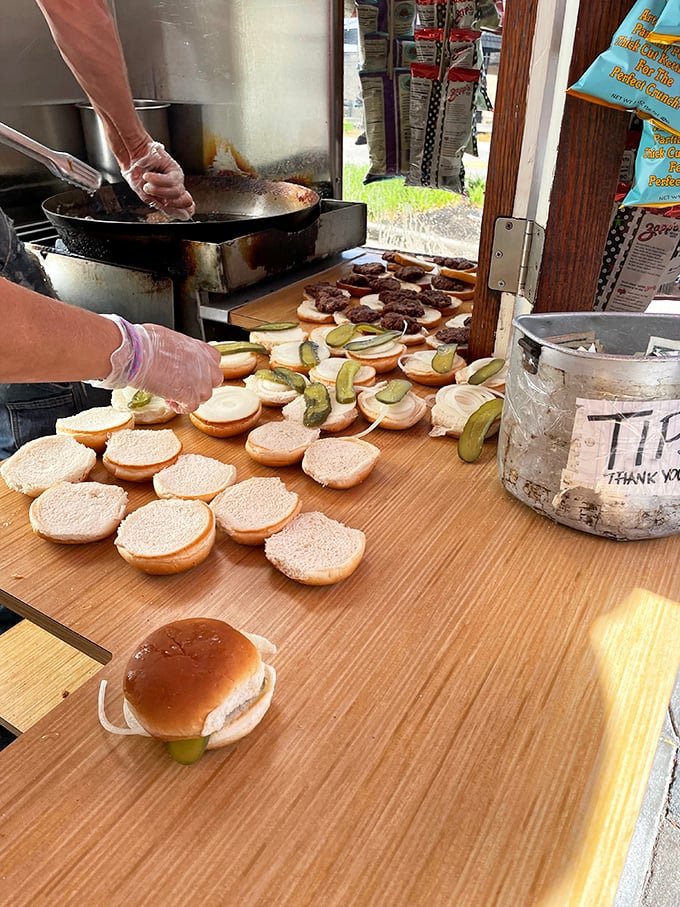 Assembly line of deliciousness! These buns are lined up like eager contestants on a tasty game show, waiting for their moment to shine.