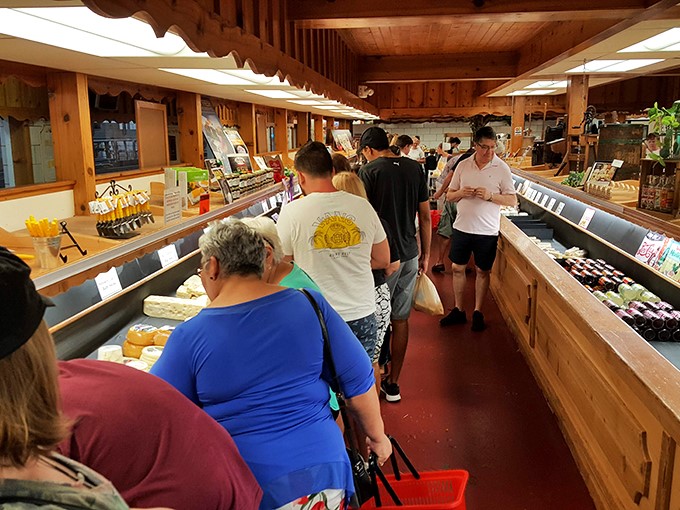 Watch out for the cheese traffic jam! These shoppers know the secret to happiness is measured in wheels and wedges.