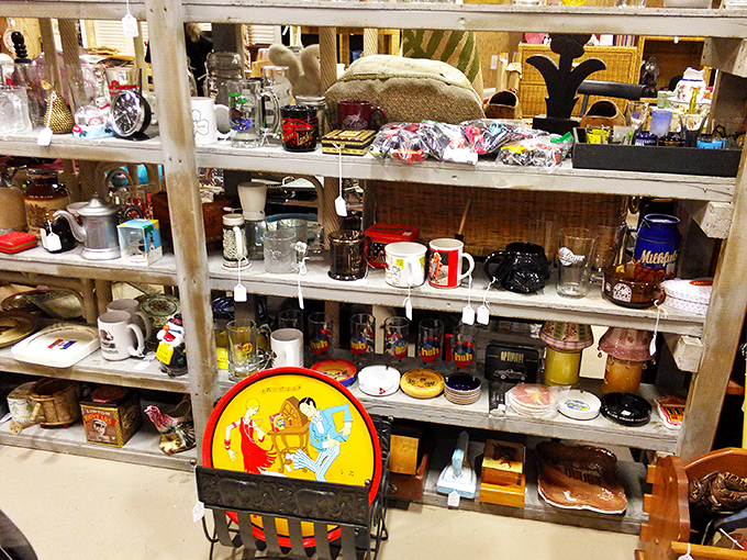 Mugs, cups, and saucers galore! This shelf is a tea party waiting to happen. Alice in Wonderland would feel right at home.