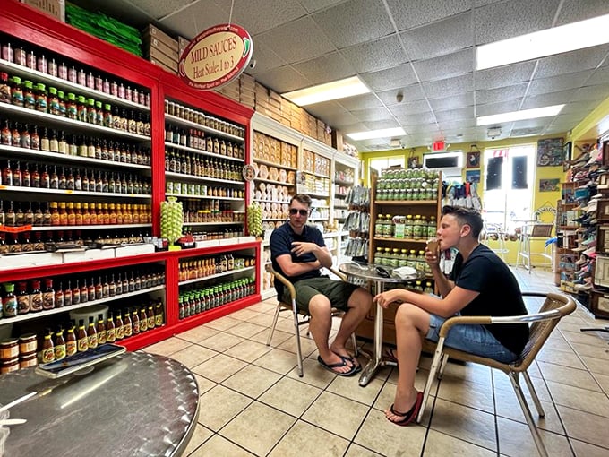 Hot sauce enthusiasts unite! These gentlemen look like they're plotting a flavor revolution, one bottle at a time.