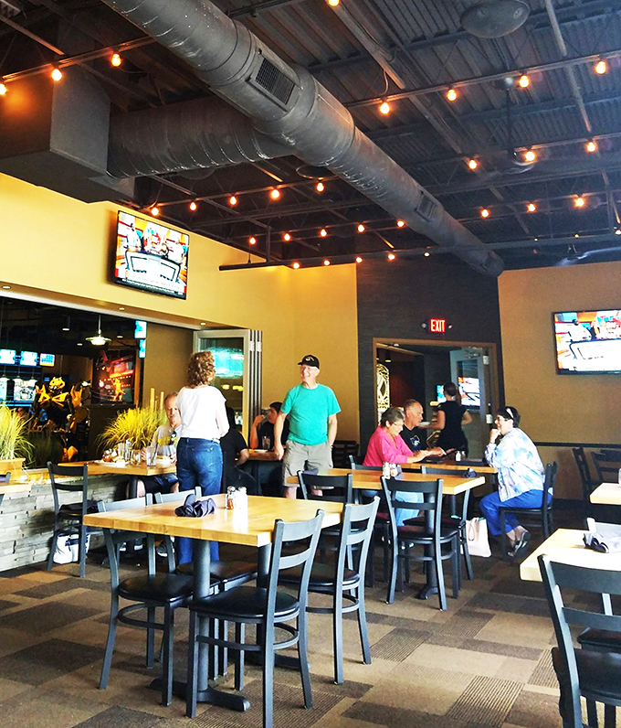 The gang's all here! Klavon's buzzes with the energy of friends and families coming together. It's like a modern Norman Rockwell painting, but with better pizza and flat-screens.