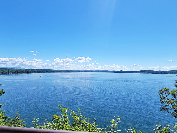 Lake Champlain: Nature's mirror, reflecting the beauty of Vermont's skies. It's like two views for the price of one!