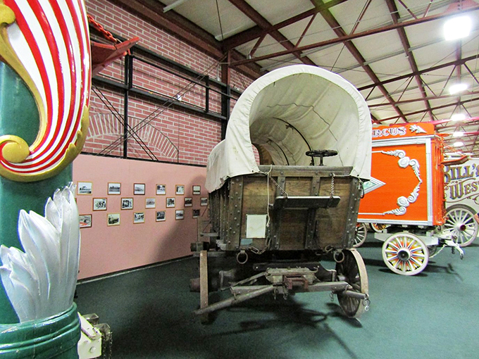 Westward ho! This covered wagon might have carried pioneers, but its circus-themed paint job suggests a more colorful journey.