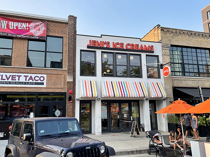 Jeni's: Where flavor combinations are bolder than your aunt's Facebook posts. That colorful awning is basically a rainbow of possibilities.