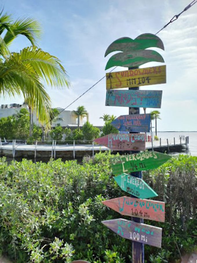 Sundowners sign: Sundowners: Where key lime pie comes with a side of spectacular sunsets. It's nature's dinner theater!