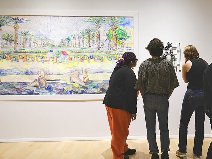 Art appreciation in full swing! These viewers are soaking up the scenery like it's the last rays of a Vermont summer. Pure visual bliss!