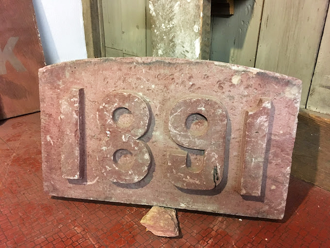 "1891: A stone-cold classic." This carved date marker is like a 19th-century time capsule, minus the buried treasure and plus a lot of weight.