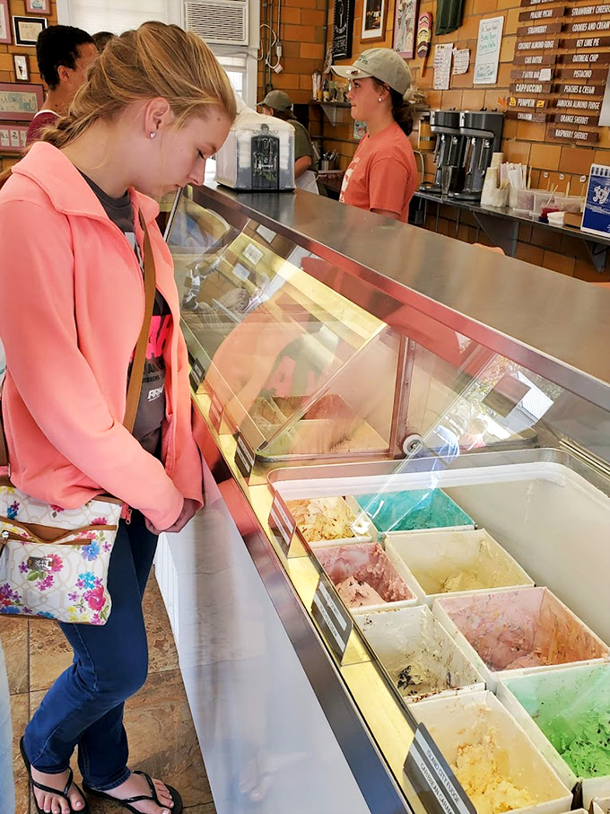 The face of pure concentration! Choosing your flavor here is serious business &ndash; and deliciously rewarding.