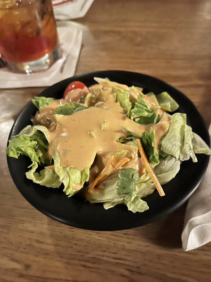 Not just a side dish! This salad, bathed in house dressing, proves vegetables can be the life of the party too.