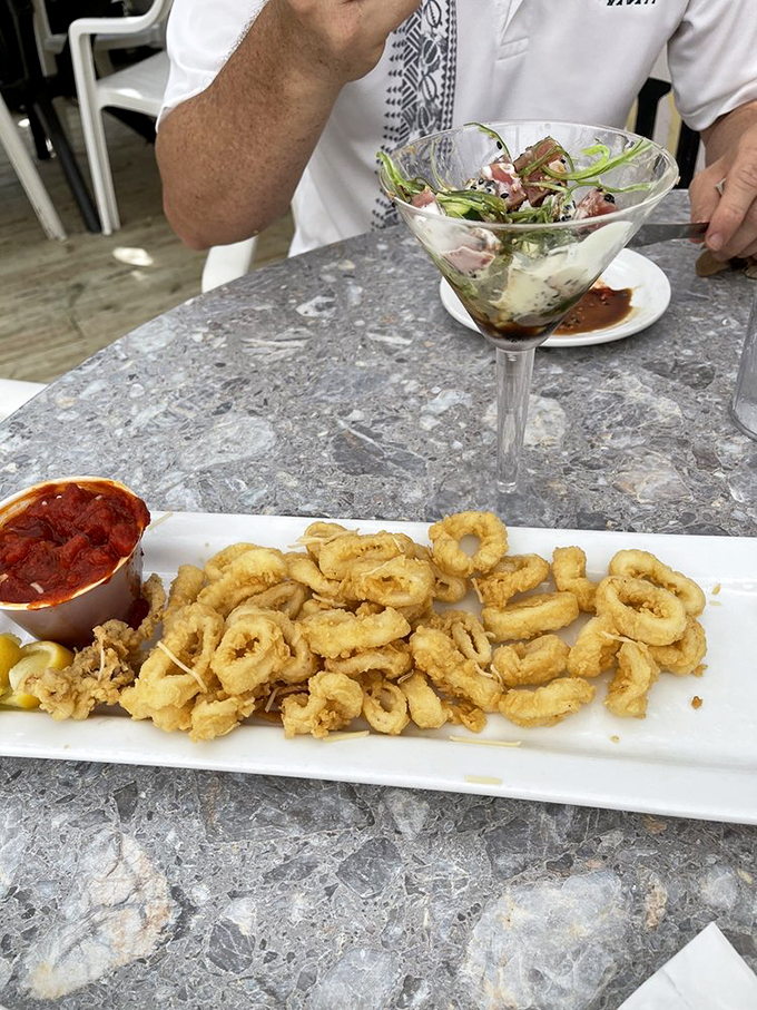 Calamari so crispy, it could star in its own ASMR video. These golden rings of deliciousness are like edible jewelry for your taste buds.
