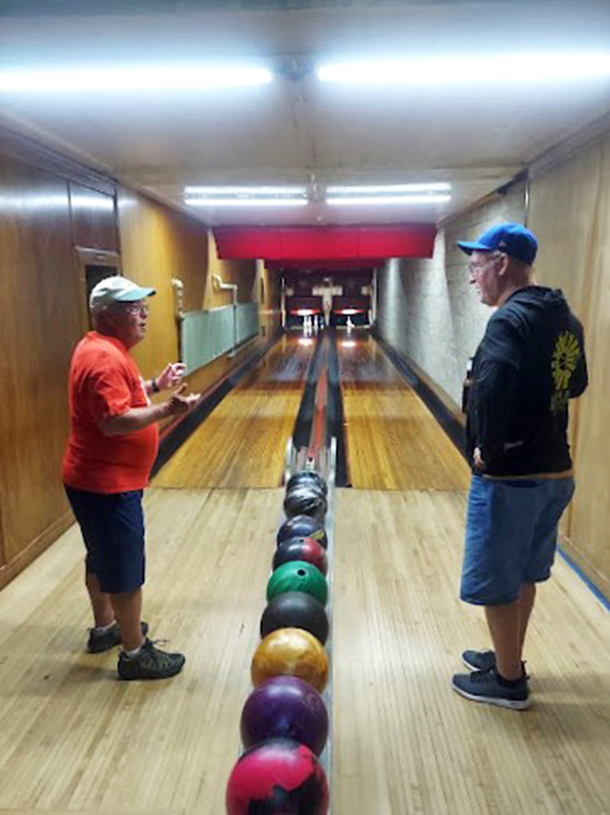 Strategy session or just shooting the breeze? At Holler House, every conversation by the lanes is a chance to perfect your game.