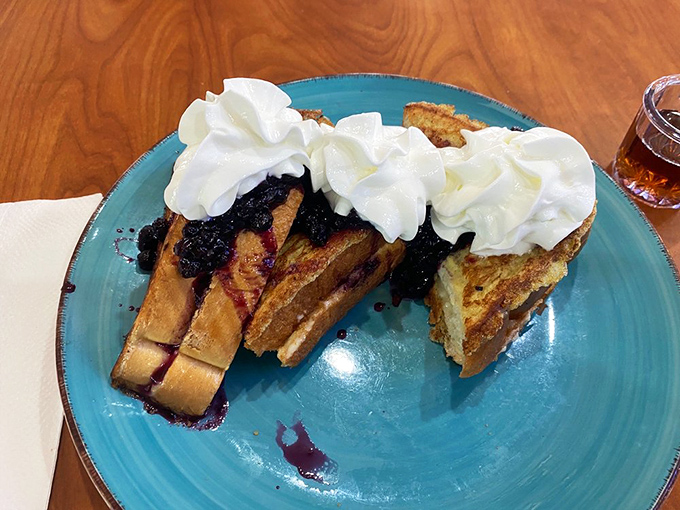 French toast so stuffed, it makes Santa look svelte! Blueberries and cream piled high enough to make you wonder if you've stumbled into Willy Wonka's breakfast room.