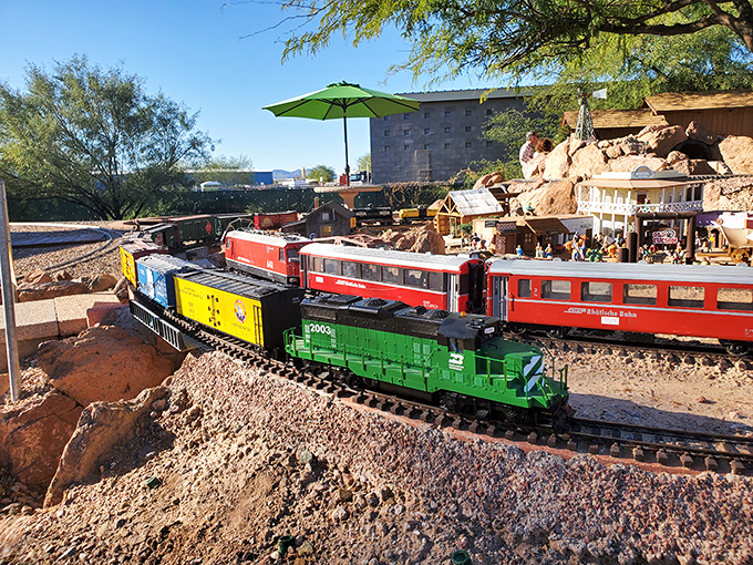 Desert meets railroad in this sun-soaked scene. It's like someone shrunk the Old West and added a dash of Thomas the Tank Engine.