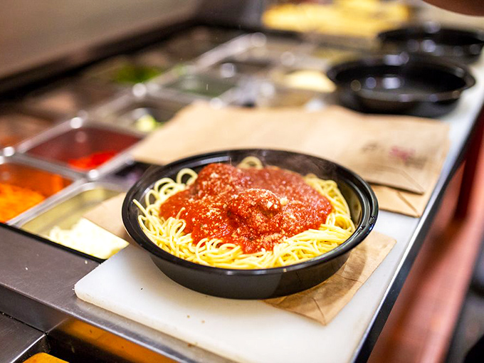"Twirl your way to happiness." This plate of pasta is like a warm hug for your taste buds, generously adorned with a sauce that screams "mangia!"