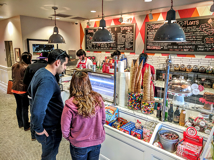 Behind the counter, where scooping isn't just a job - it's an art form. Watch the maestros at work!