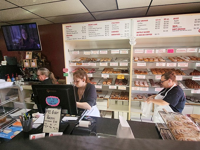 The donut dream team! These dedicated staff members are the unsung heroes behind your sugar-coated happiness.