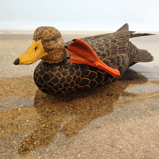 This wooden duck looks so real, you might expect it to waddle right off its perch and head for water.