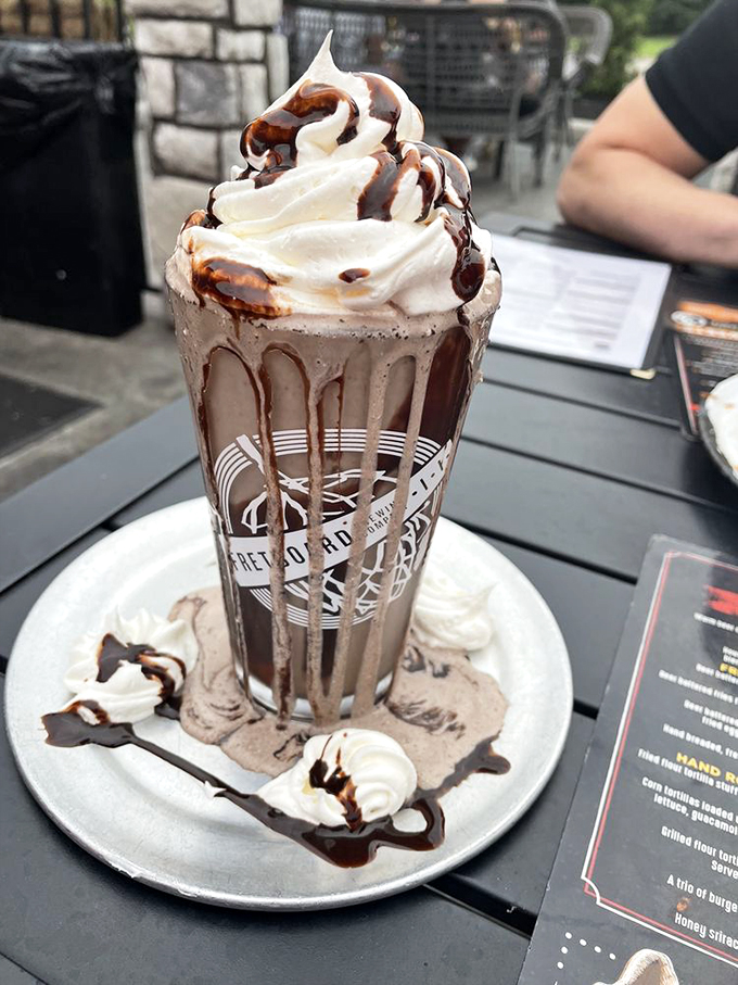 Holy cow! This Oreo milkshake is taller than my grandson. It's a skyscraper of sweetness that'll make your inner child jump for joy.