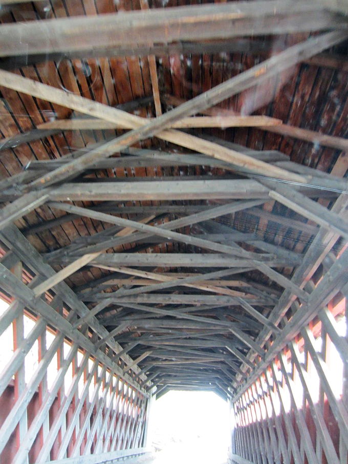 Look up! The bridge's intricate roof structure is a testament to old-school craftsmanship. No IKEA instructions needed here!