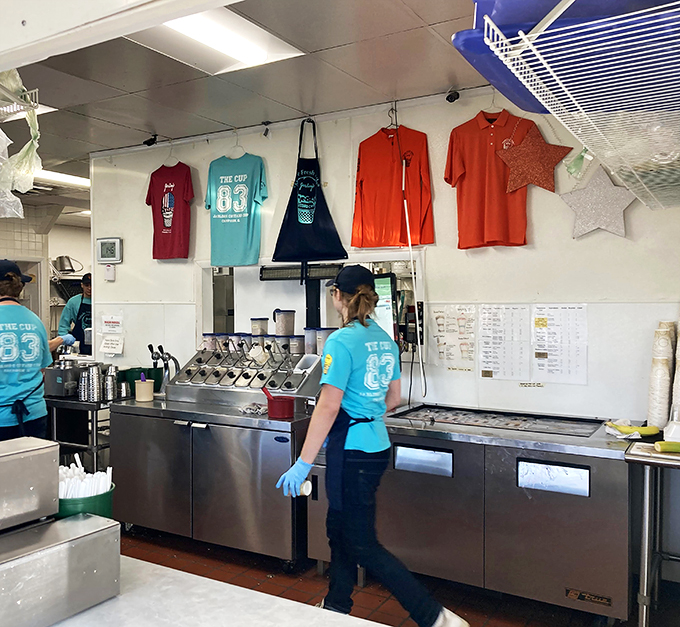 Custard crusaders at work! These ice cream artisans are the unsung heroes of happiness, armed with scoops and ready to serve.