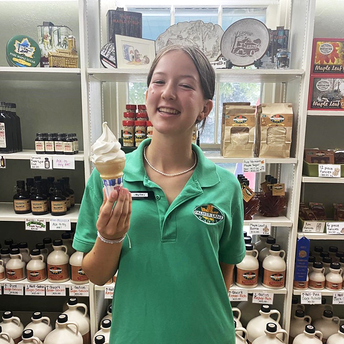 Smile and say "Creemee"! This cheerful staff member is serving up joy one cone at a time.