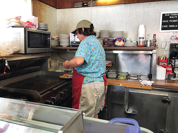 The wizard behind the curtain... or in this case, the grill. Watch in awe as your meal materializes before your very eyes.